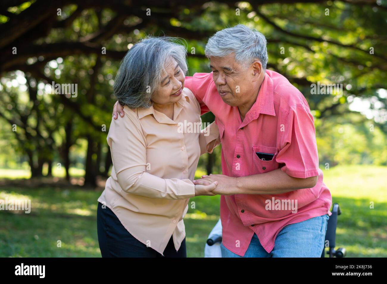 Asian senior man falling down on lying floor at park after Stumbled and ...