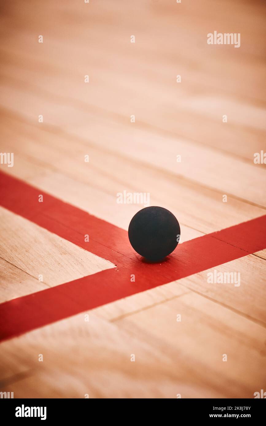 The better the ball the better the play. a squash ball on the floor of ...