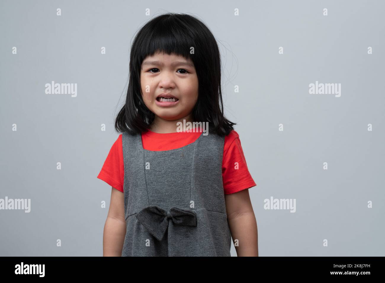 Portrait of Asian angry, sad and cry little girl on white isolated ...