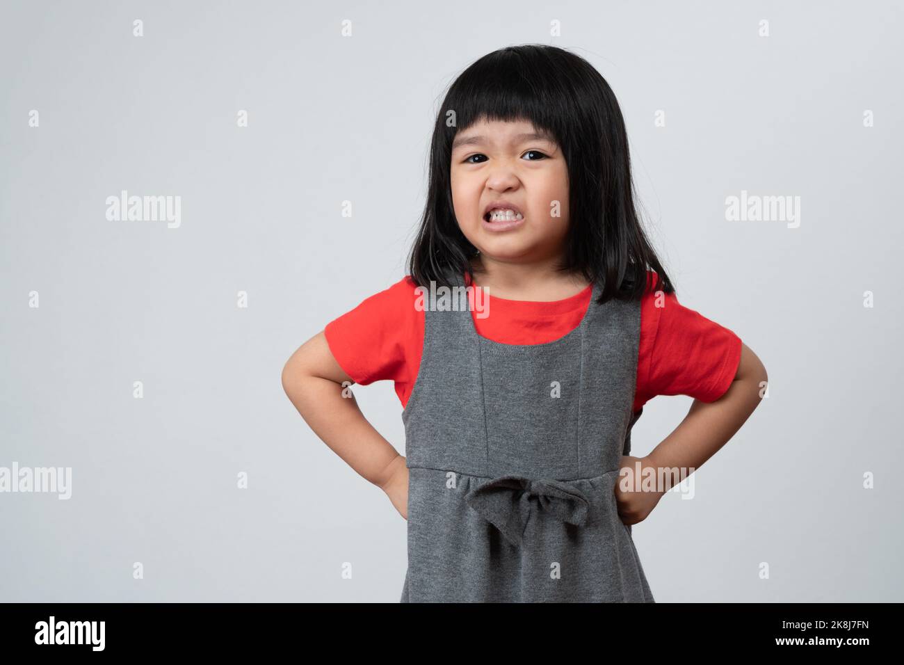 Portrait of Asian angry and sad little girl on white isolated ...