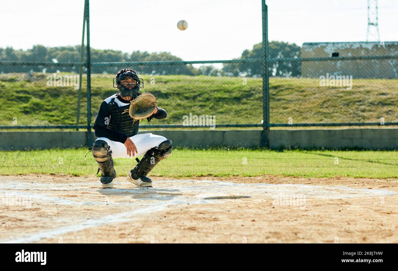 What a well timed catch. Full length shot of a young baseball player ...