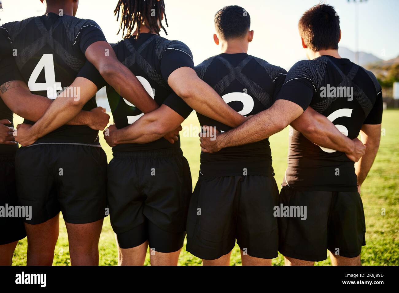 Nothing can tear us apart. a unrecognizable group of sportsmen standing ...