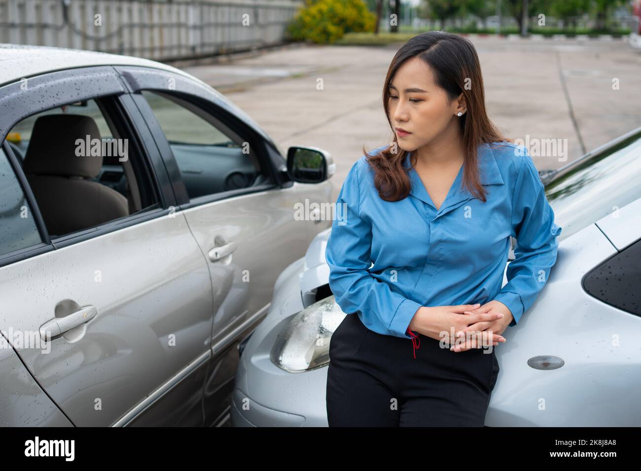 Women drivers sad after a car accident because not have car accident ...