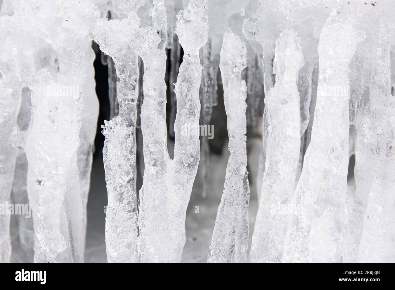 Frosty ice icicles winter background Stock Photo - Alamy