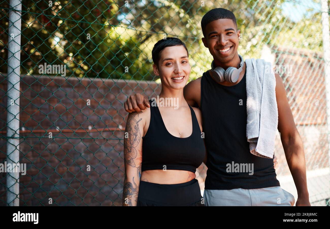 Supporting each other will benefit us both. Portrait of two sporty ...