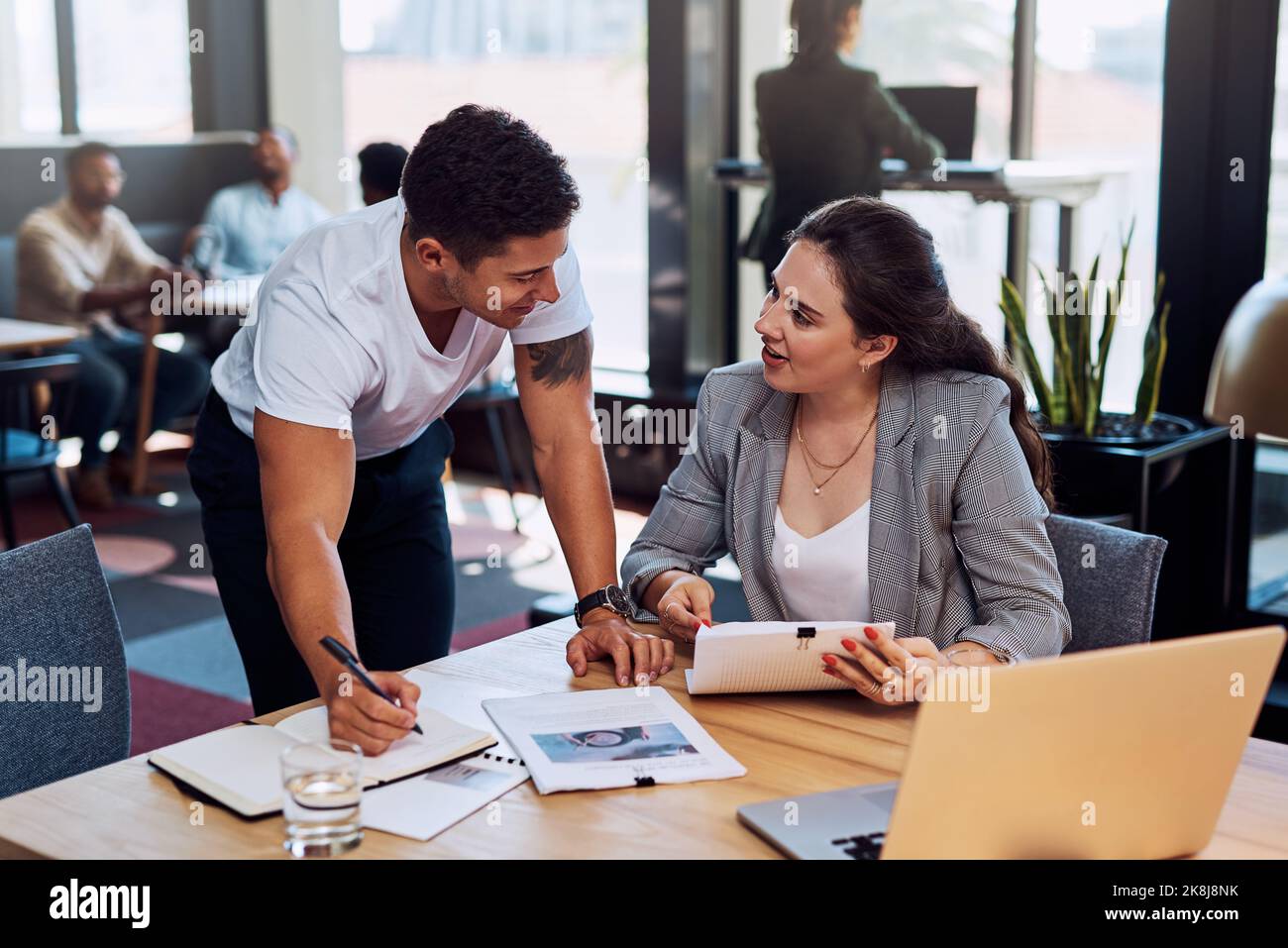 Professional businesspeople discussing together in hi-res stock ...