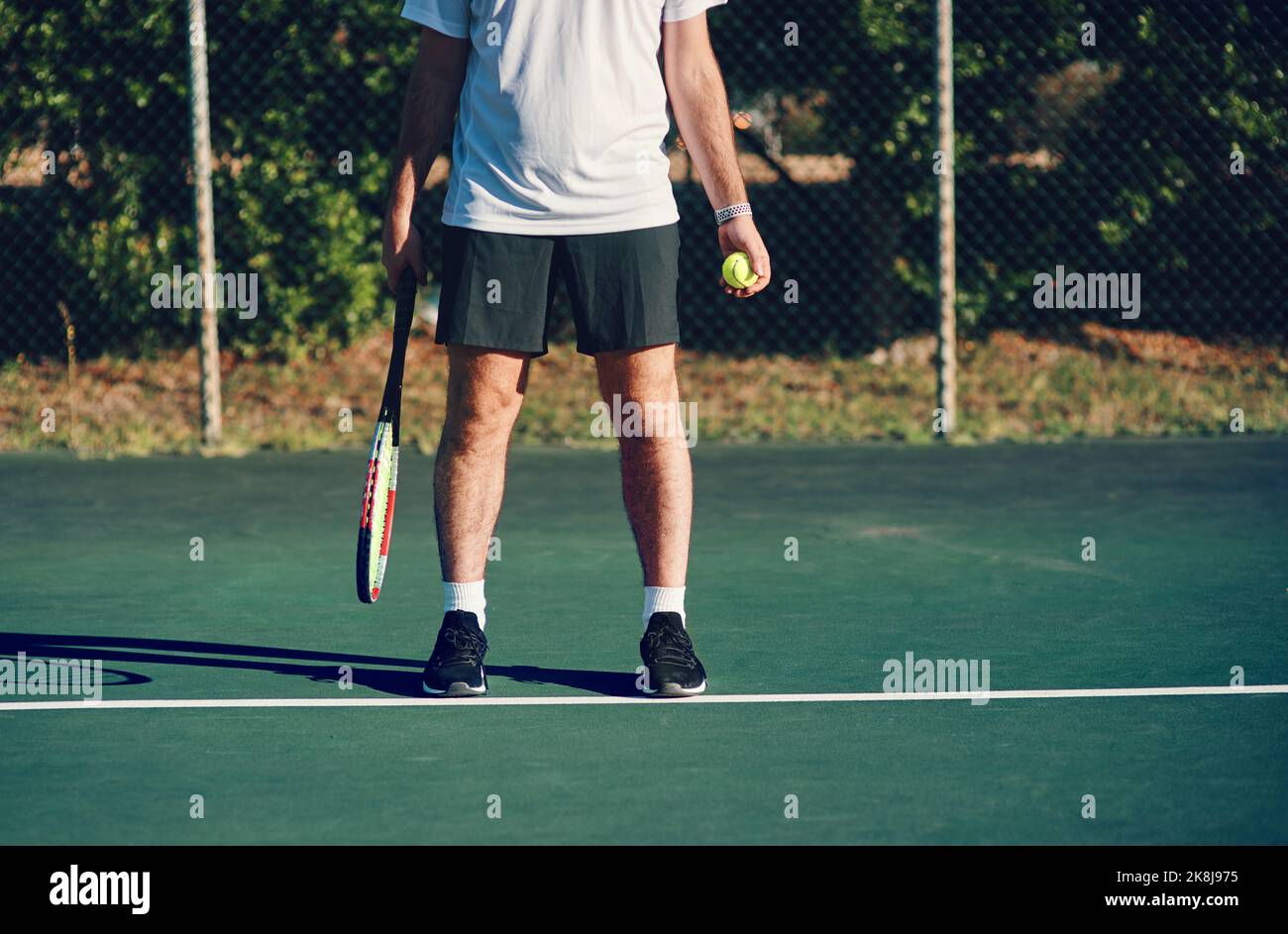 Keep calm and serve an ace. Closeup shot of an unrecognisable man ...