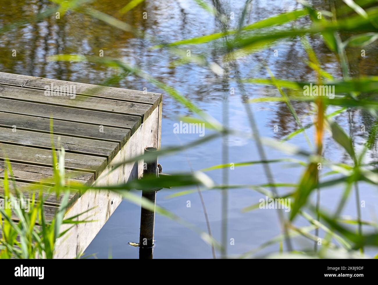 small jetty over calm water in Kumla Sweden Stock Photo - Alamy