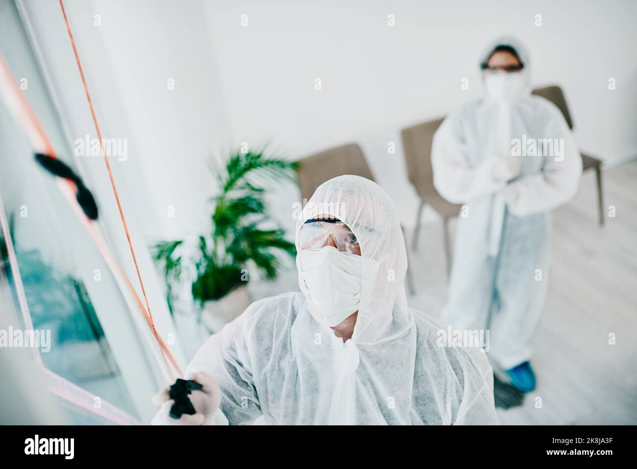 Coronavirus hates a clean surface. healthcare workers wearing hazmat ...