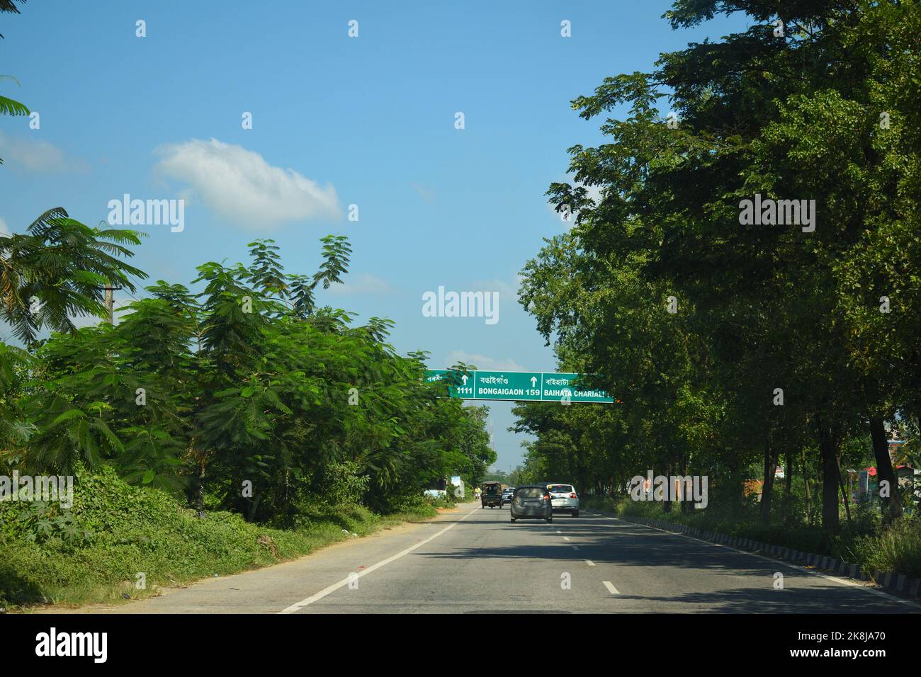 A Road Direction Board on National Highway 37 of Assam showing distance ...