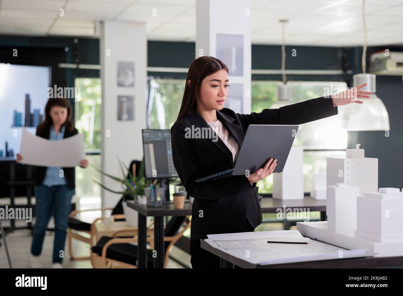 Architect working with city construction project in architecture office ...