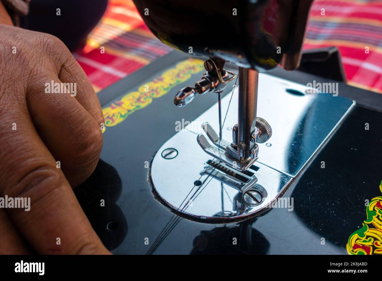 february 12th 2022, Dehradun City India. Hands operating manual Sewing ...