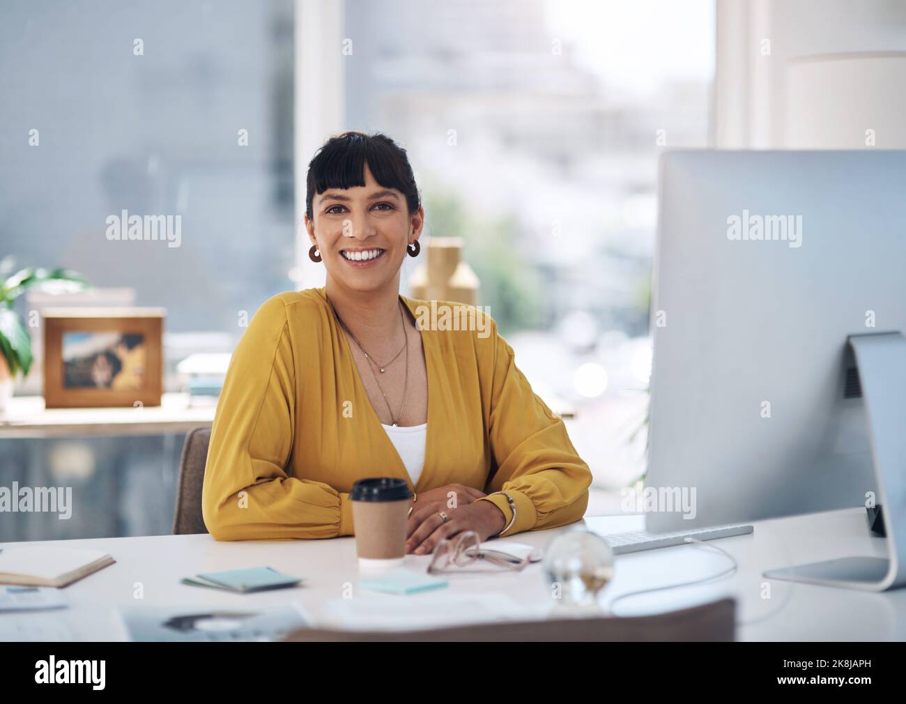 Just a typical day in the office. Cropped portrait of an attractive young businesswoman sitting ...