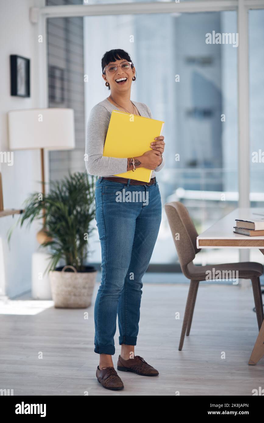 The paperwork never ends. Full length portrait of an attractive young businesswoman standing ...