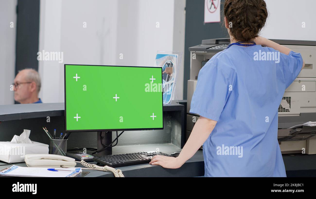 Medical nurse working with greenscreen on computer at hospital ...