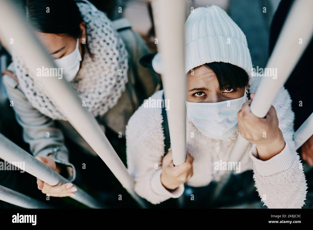 We dont belong here. a group of young people wearing masks while stuck ...