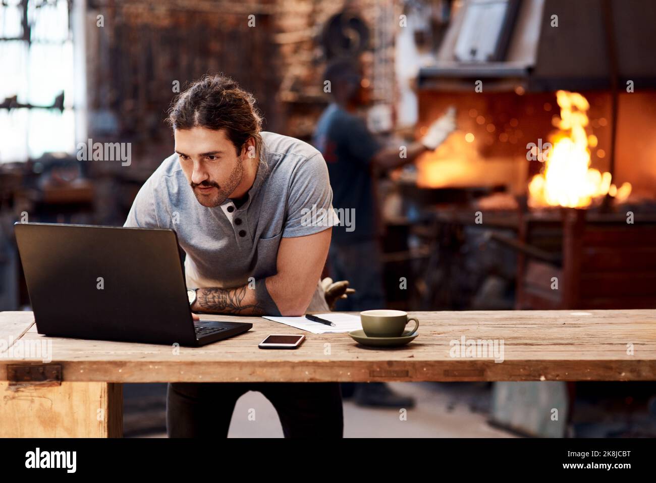 Make use of online tools to grow your business. a handsome young ...