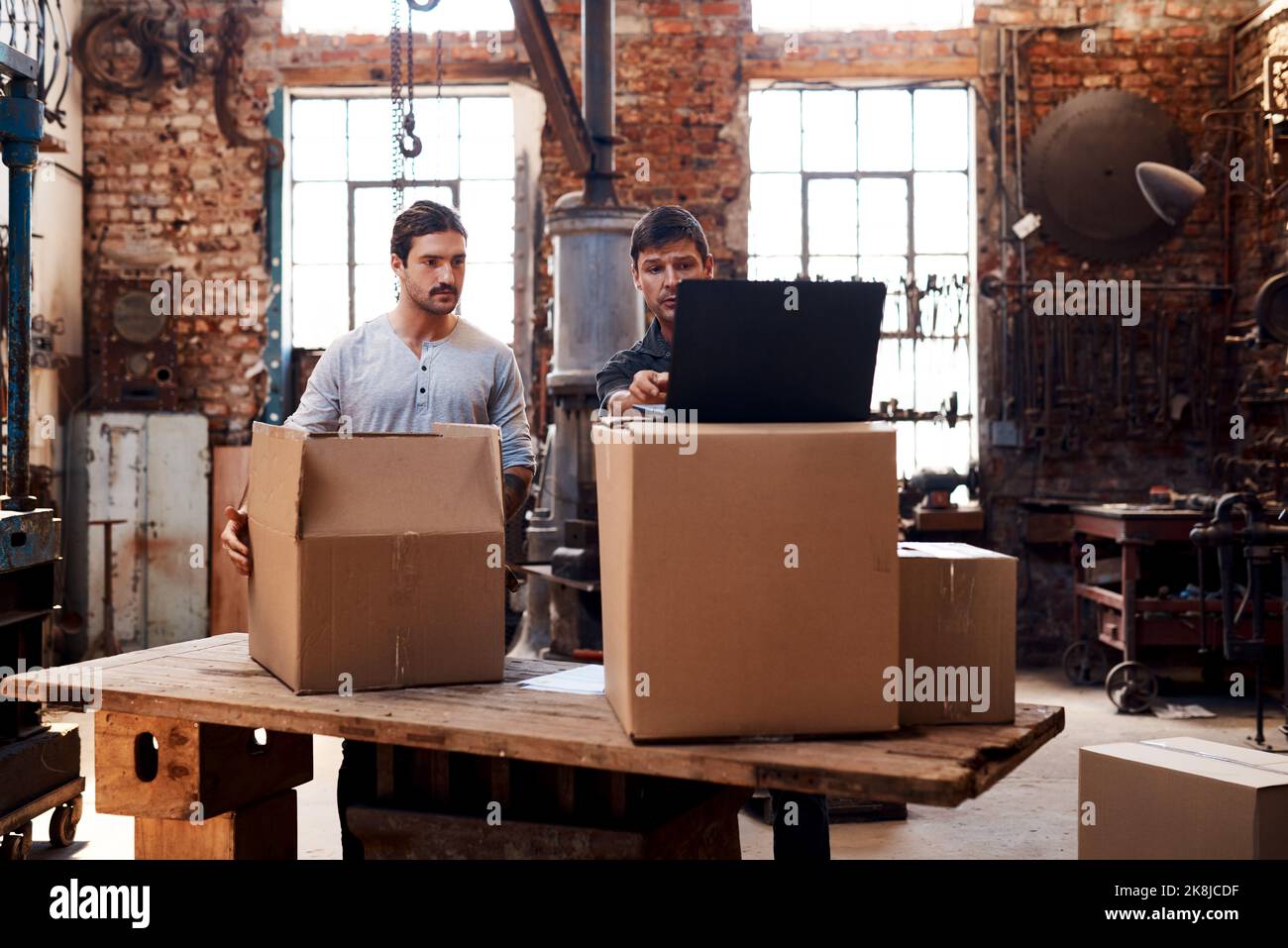 Were sorting out orders and deliveries today. two young businessmen ...