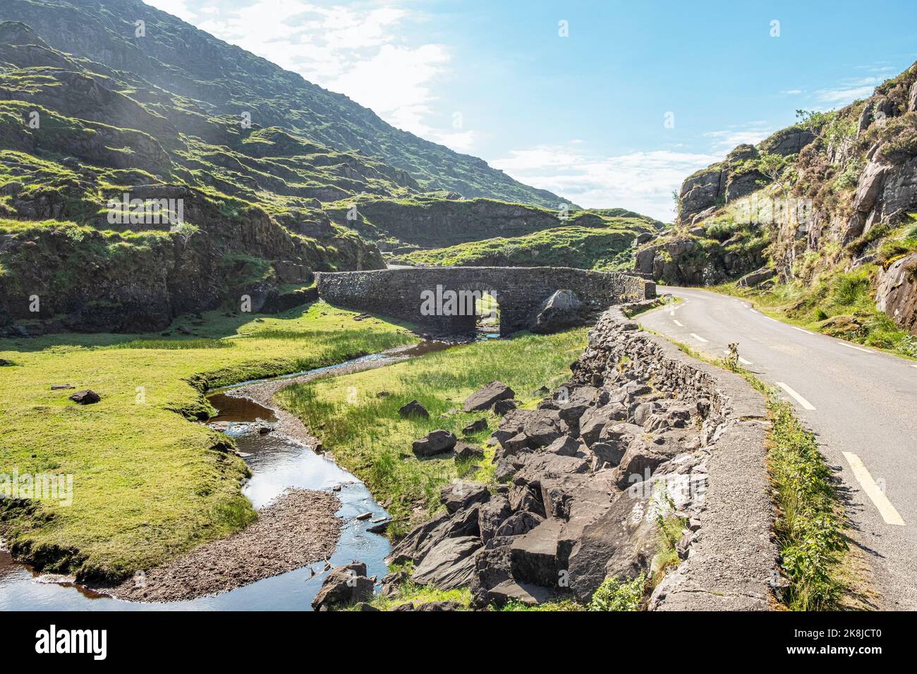 The old Wishing Bridge in green valley, Gap of Dunloe in Black Valley ...