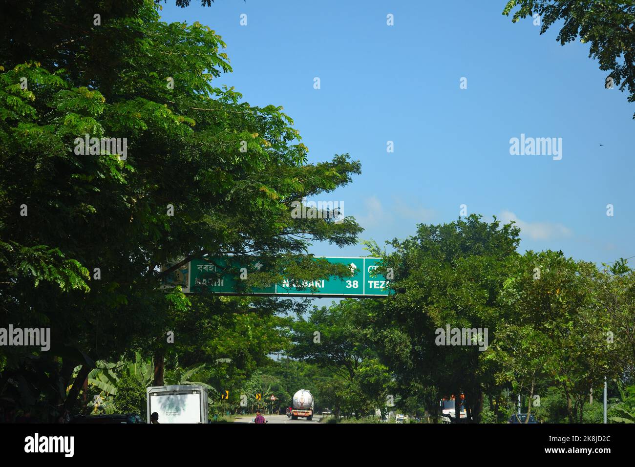 A Road Direction Board on National Highway 37 of Assam showing distance ... A Road Direction Board on National Highway 37 of Assam showing distance ...