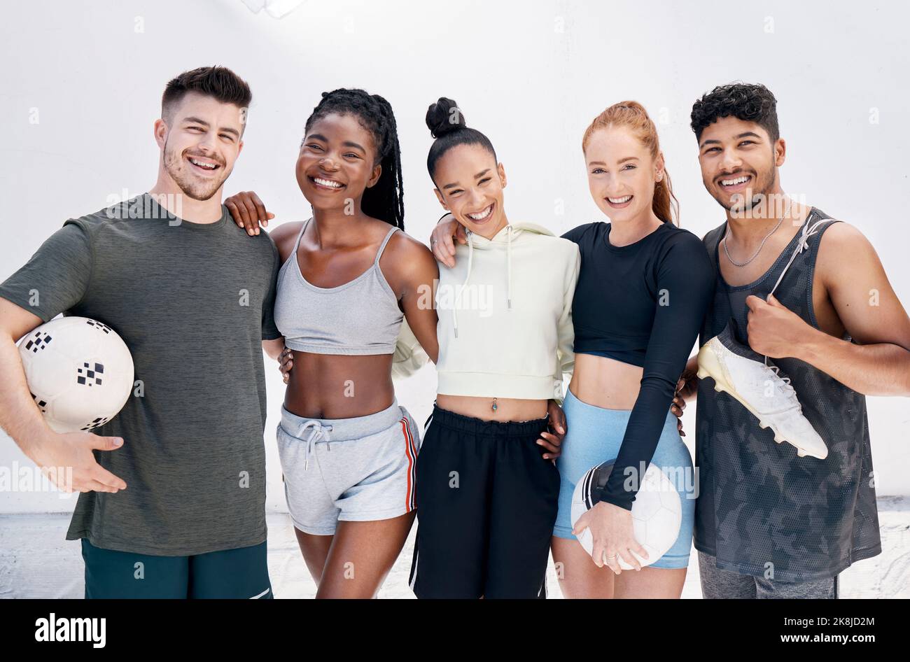 Sports, team and diversity football friends relax after game ...
