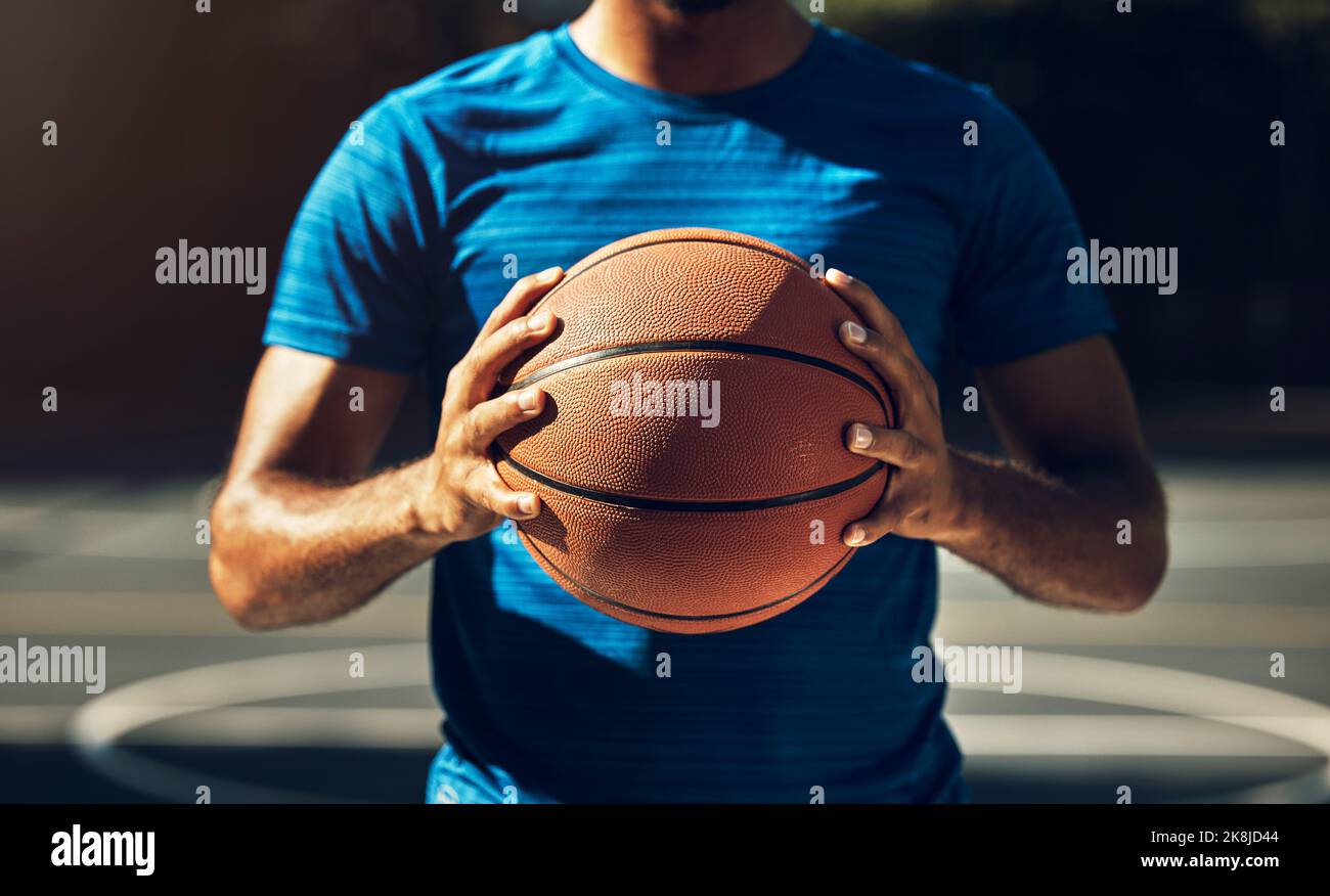 Basketball player, man hands and ball in basketball court, outdoor ...