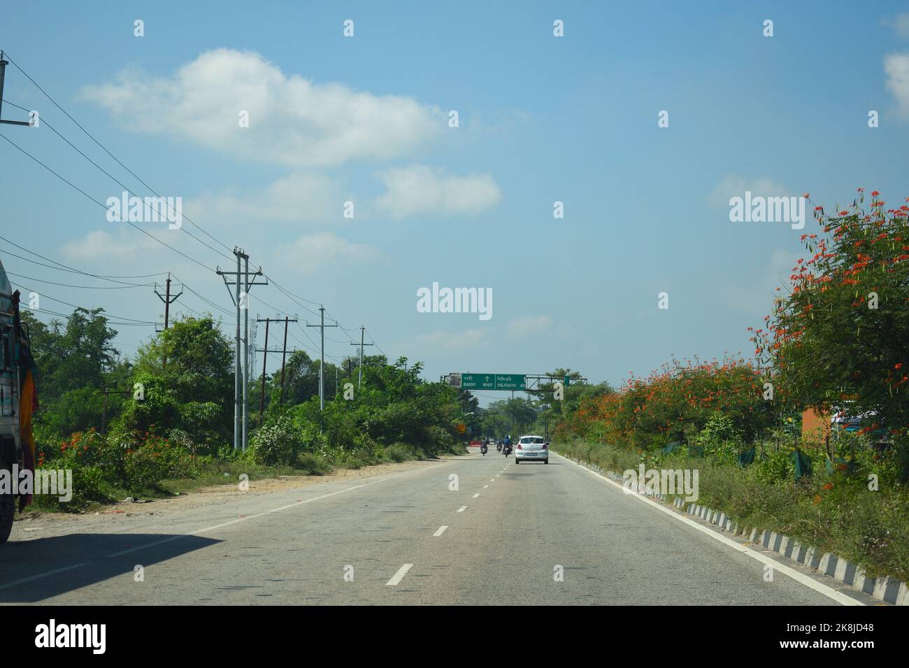 A Road Direction Board on National Highway 37 of Assam showing distance ... A Road Direction Board on National Highway 37 of Assam showing distance ...