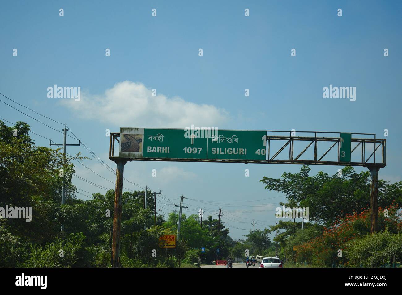 A Road Direction Board on National Highway 37 of Assam showing distance ...