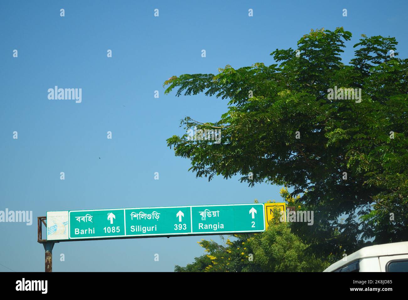 A Road Direction Board on National Highway 37 of Assam showing distance ... A Road Direction Board on National Highway 37 of Assam showing distance ...