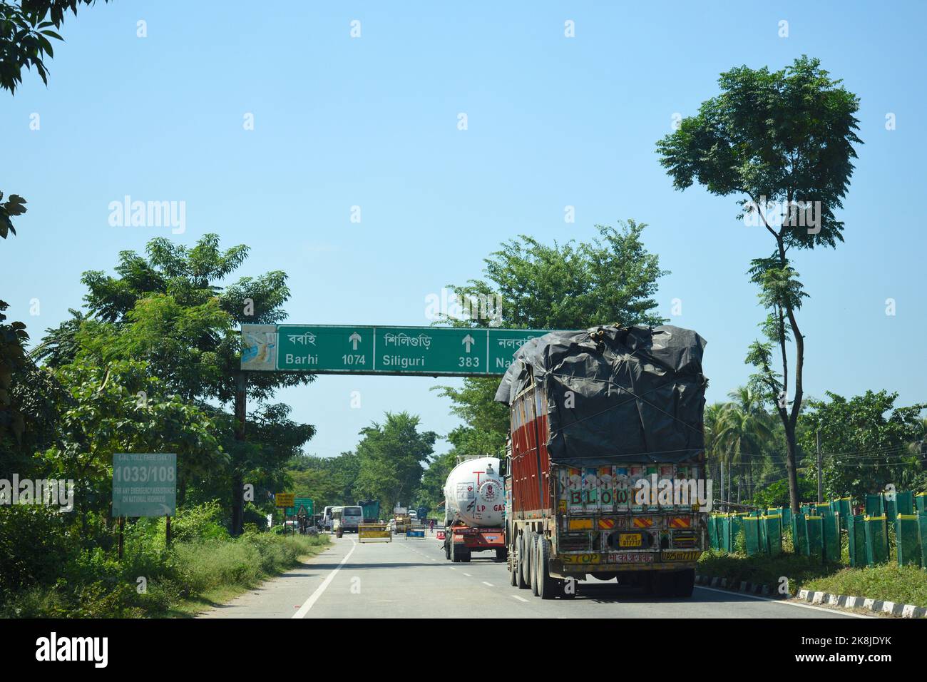 A Road Direction Board on National Highway 37 of Assam showing distance ...