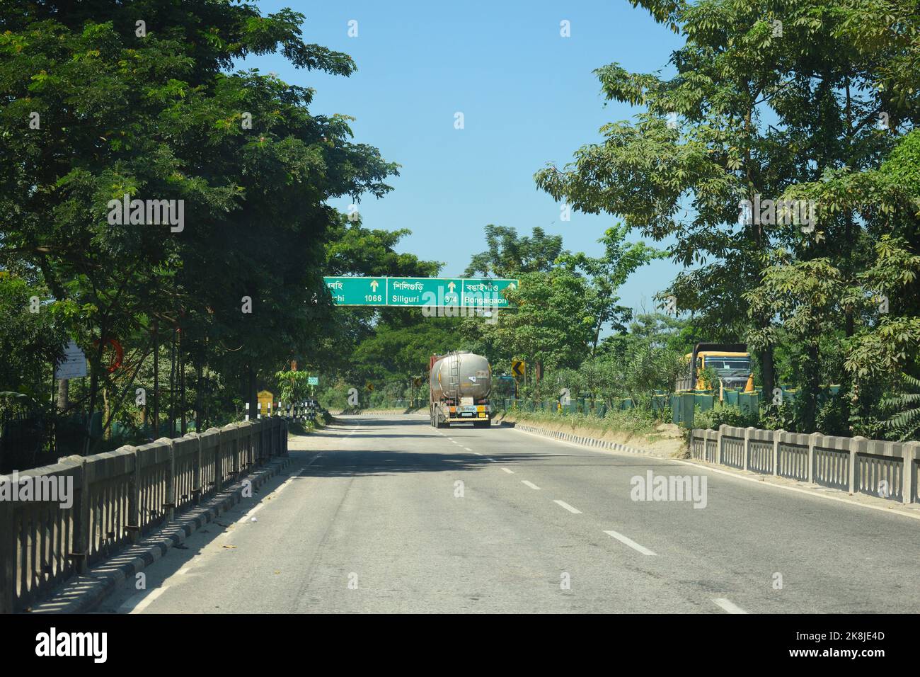 A Road Direction Board on National Highway 37 of Assam showing distance ...