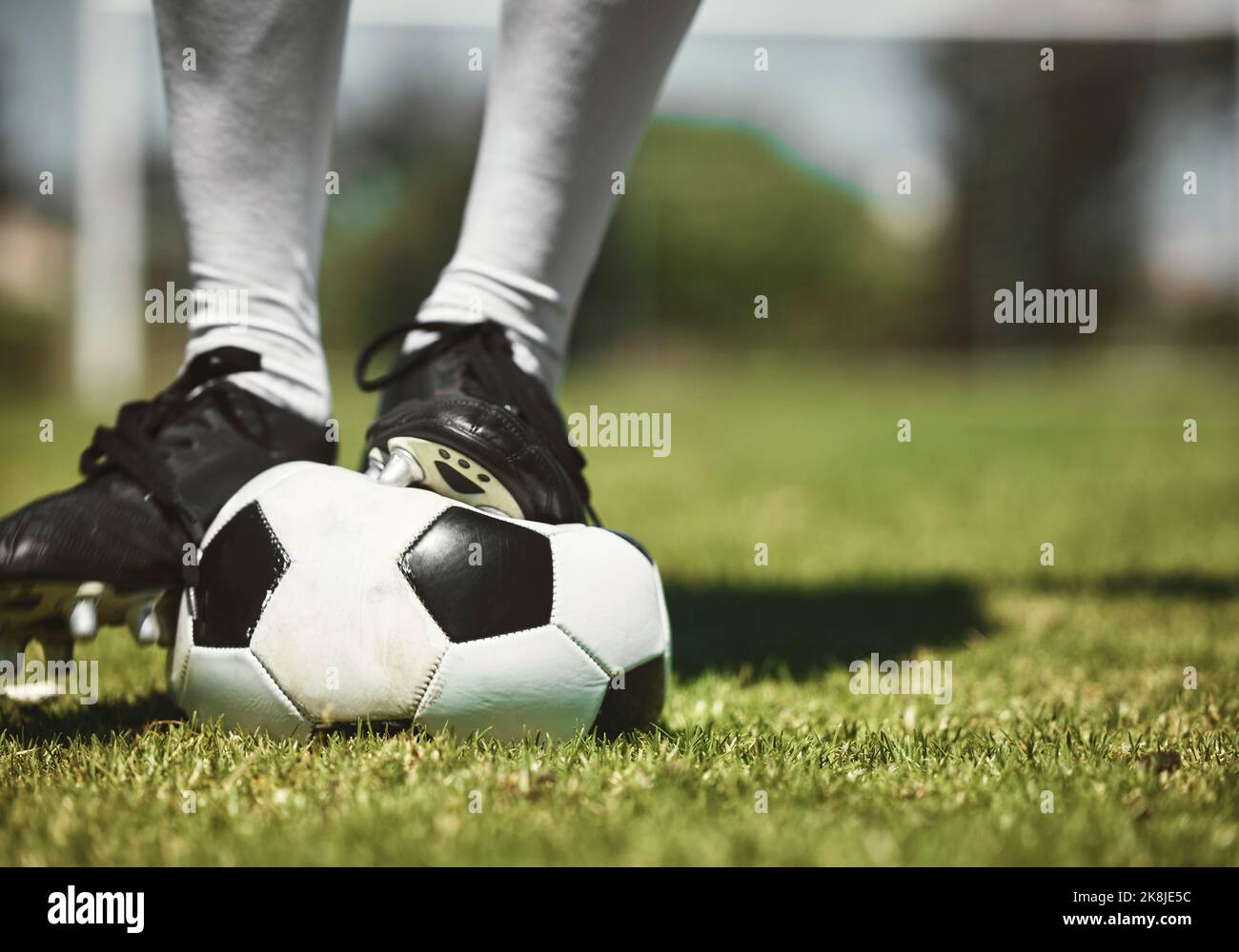 Soccer player feet, deflated soccer ball and sports, competition game ...