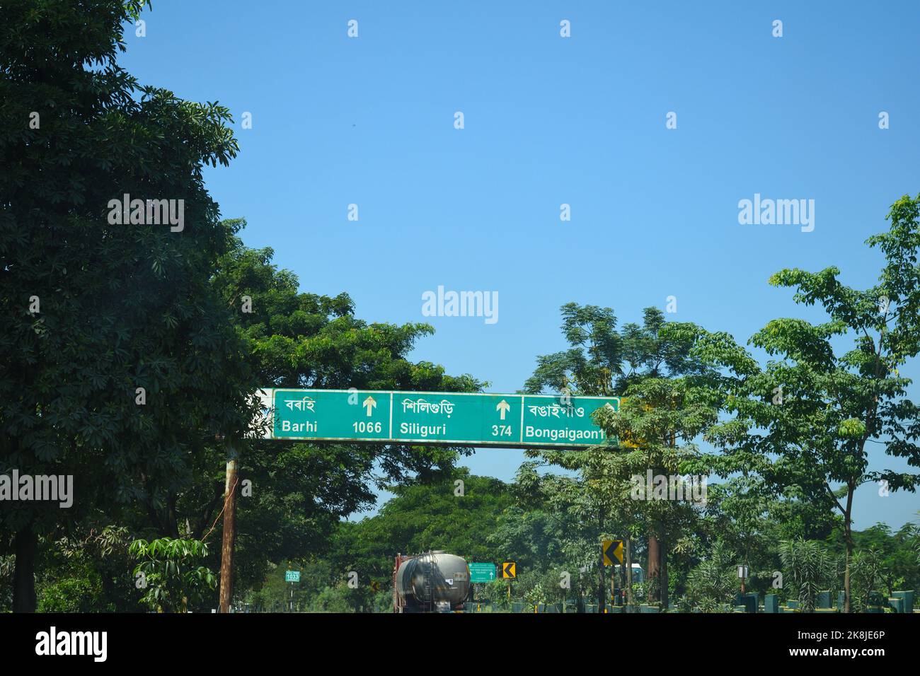 A Road Direction Board on National Highway 37 of Assam showing distance ...
