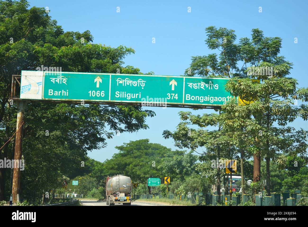 A Road Direction Board on National Highway 37 of Assam showing distance ... A Road Direction Board on National Highway 37 of Assam showing distance ...