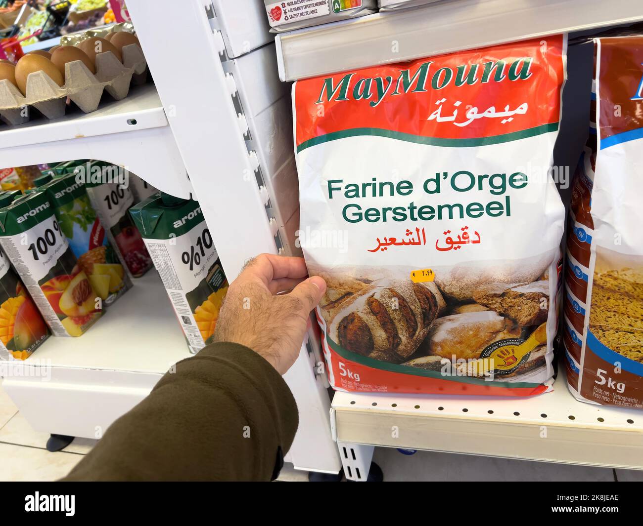 Paris, France - Oct 21, 2022: POV male hand buying taking from oriental ...