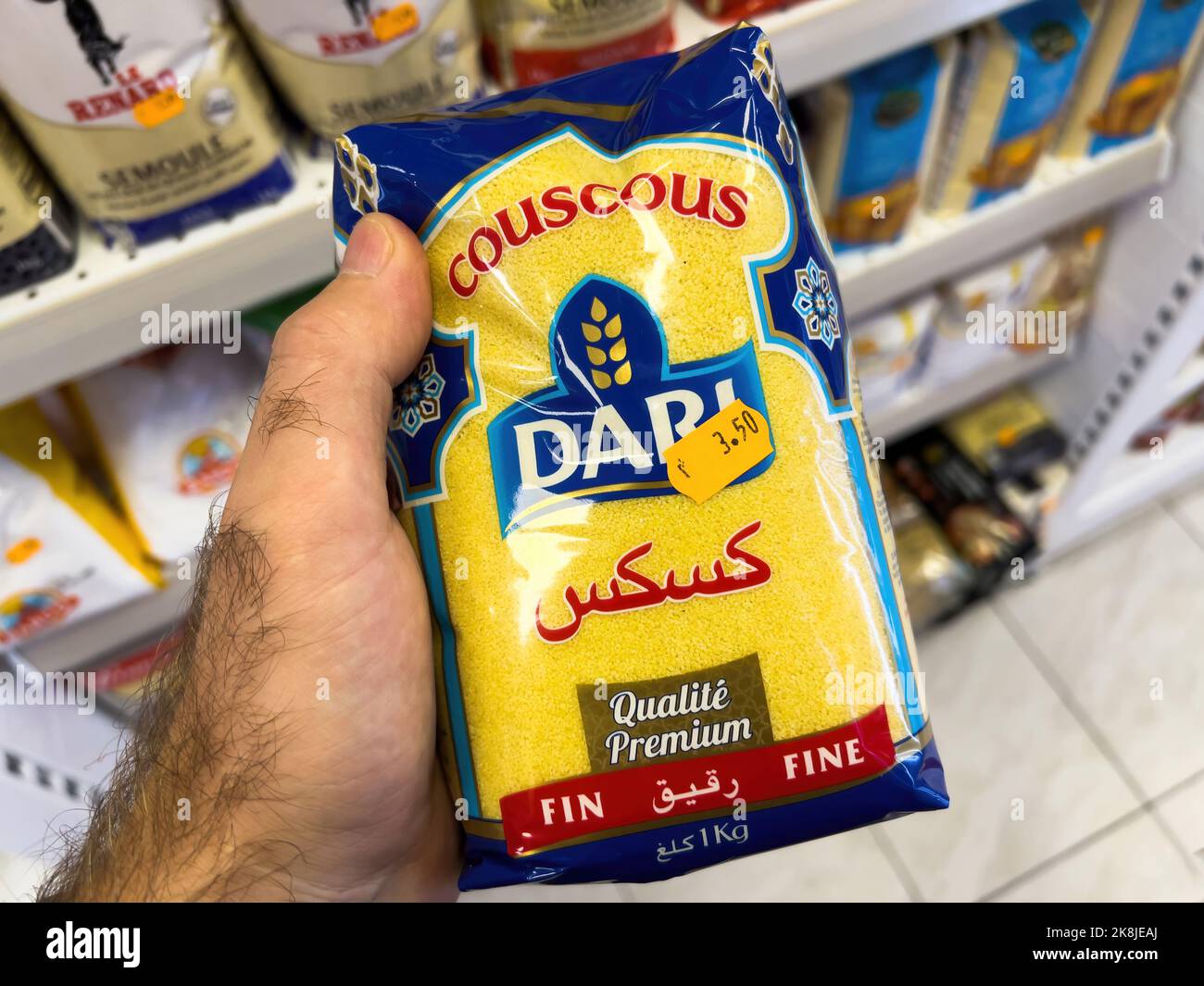 Paris, France - Oct 21, 2022: POV male hand holding delicious Couscous ...