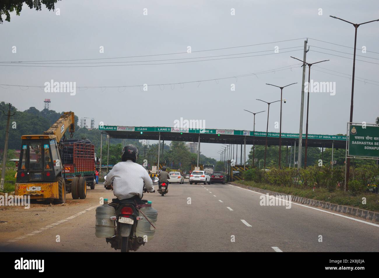 Vehicle passing through Nazirakahat (Sonapur) toll gate towards upper ...