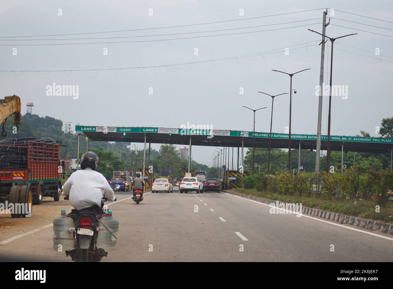 Vehicle passing through Nazirakahat (Sonapur) toll gate towards upper ...