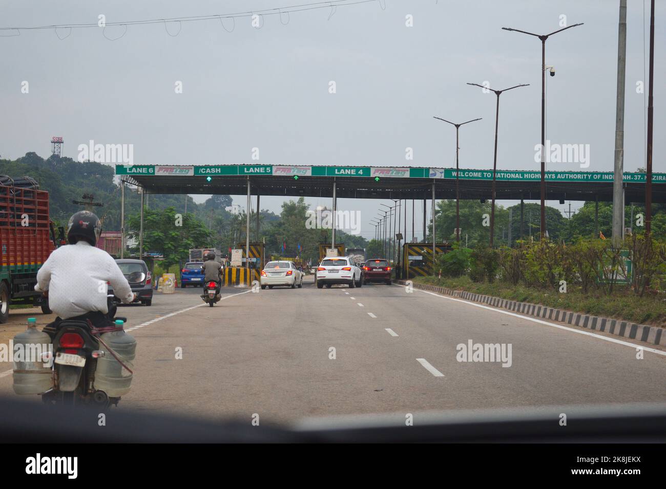 Vehicle passing through Nazirakahat (Sonapur) toll gate towards upper ...