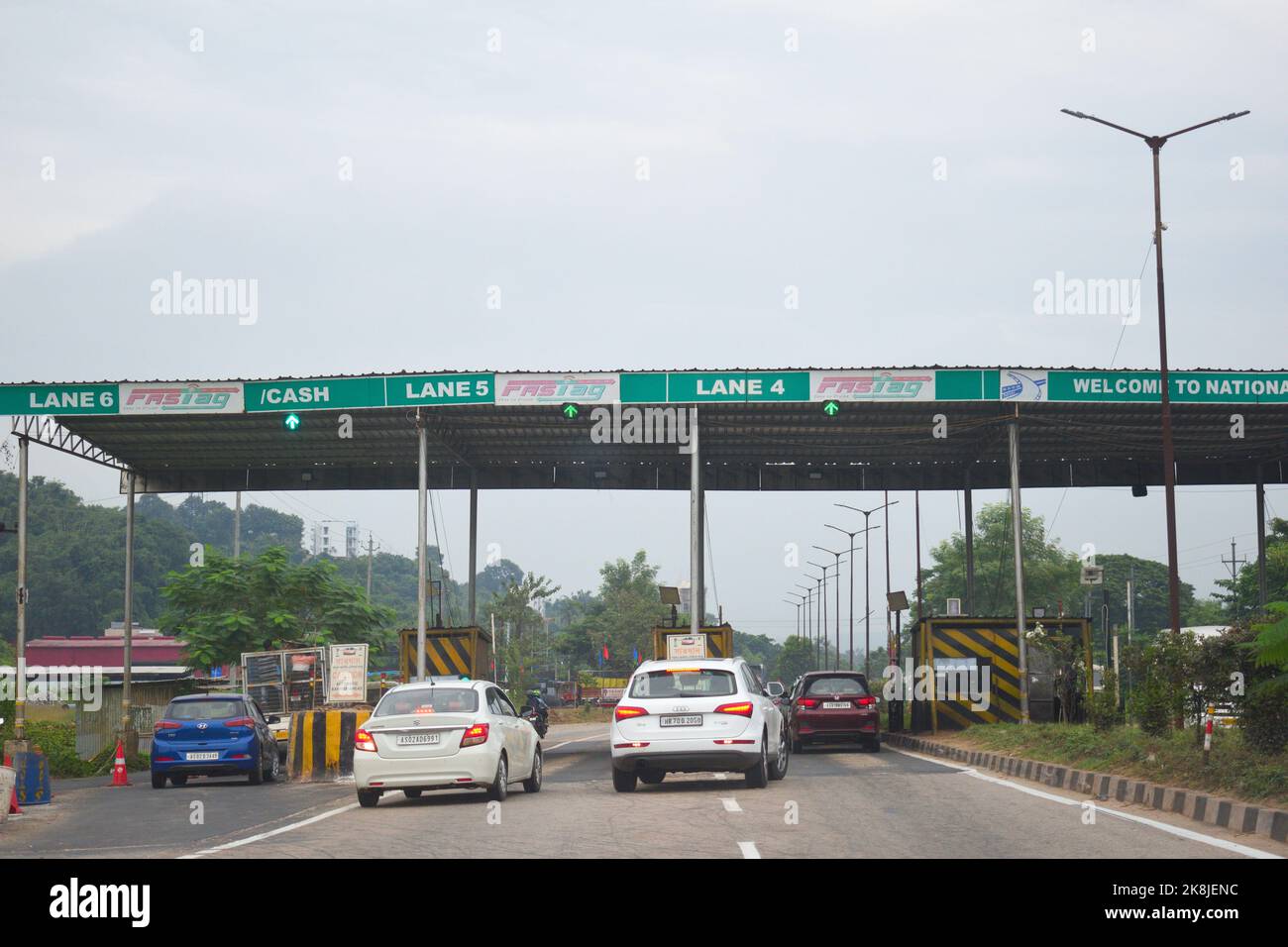 Vehicle passing through Nazirakahat (Sonapur) toll gate towards upper ...