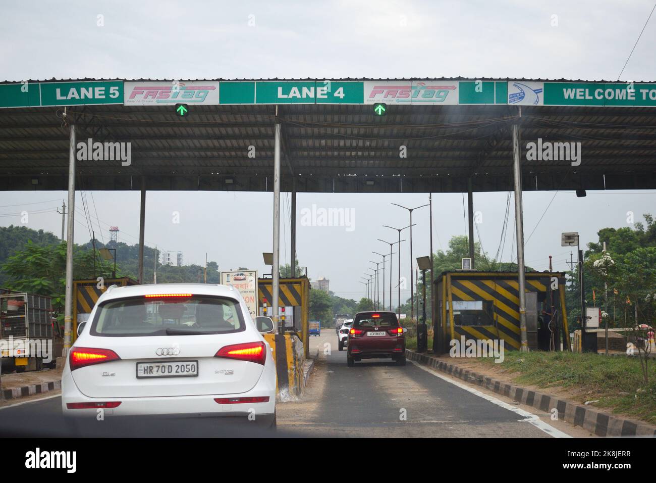Vehicle passing through Nazirakahat (Sonapur) toll gate towards upper ...