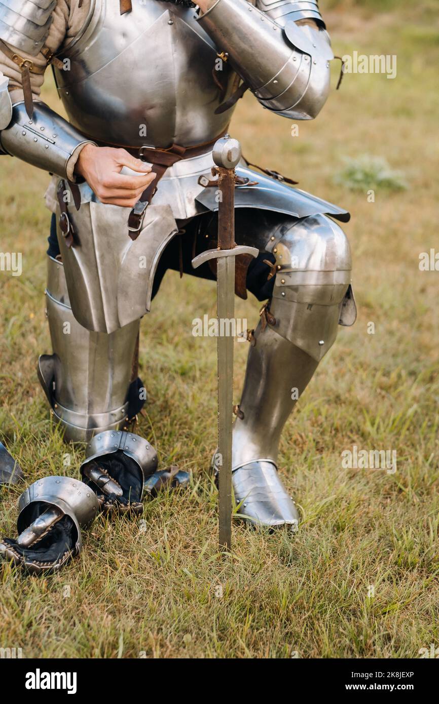 Close-up of a medieval knight in armor preparing for battle Stock Photo ...