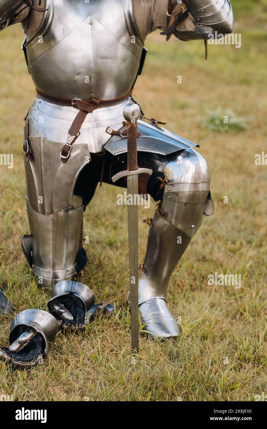 Close-up of a medieval knight in armor preparing for battle Stock Photo ...