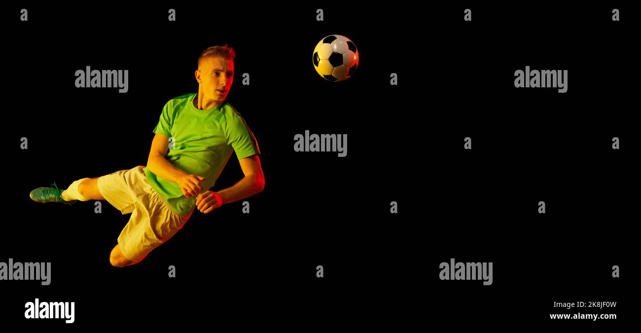 Goal. Young soccer, football player in motion and action with ball ...