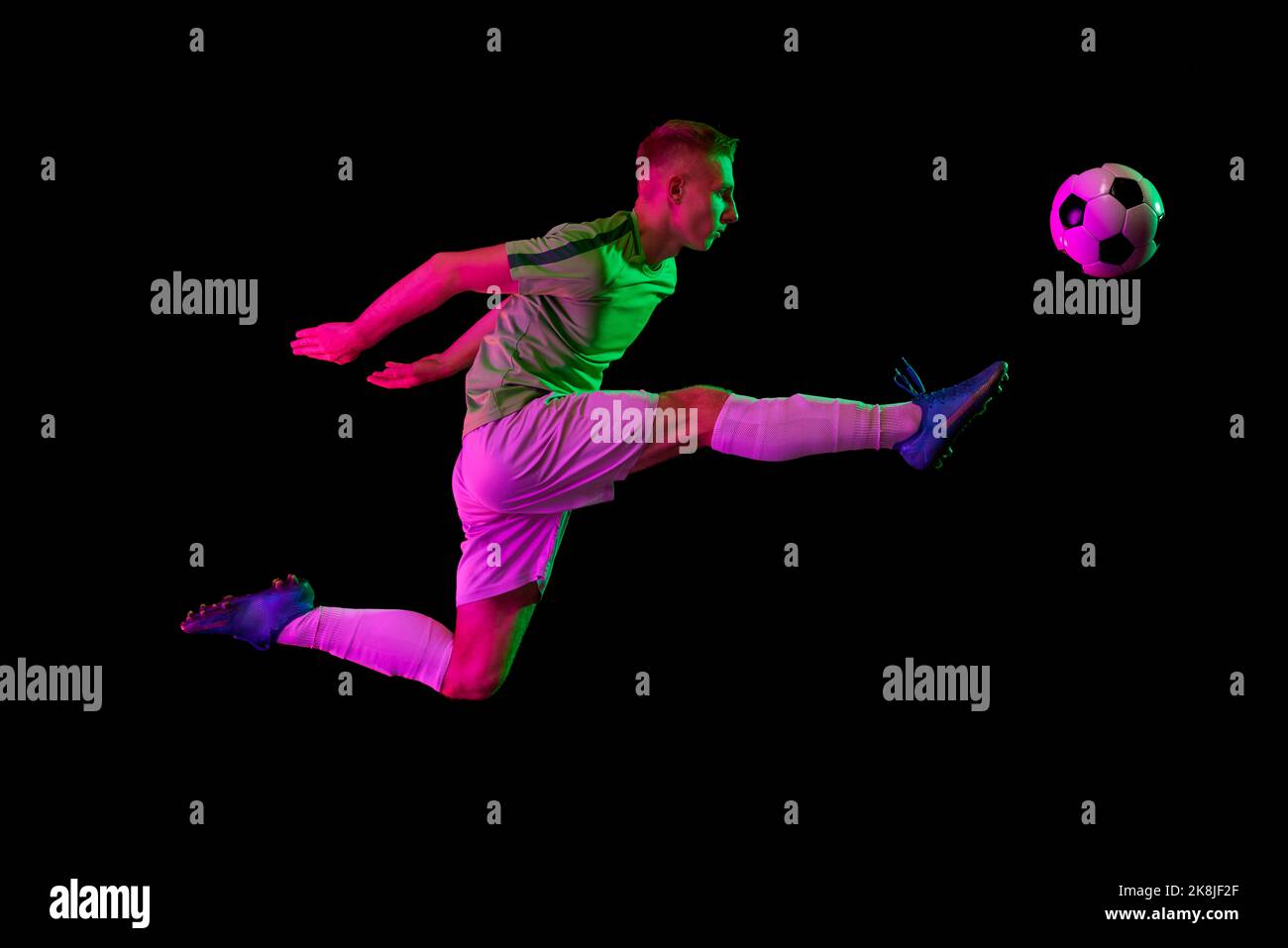 Sport in action. One man professional soccer player training with ...