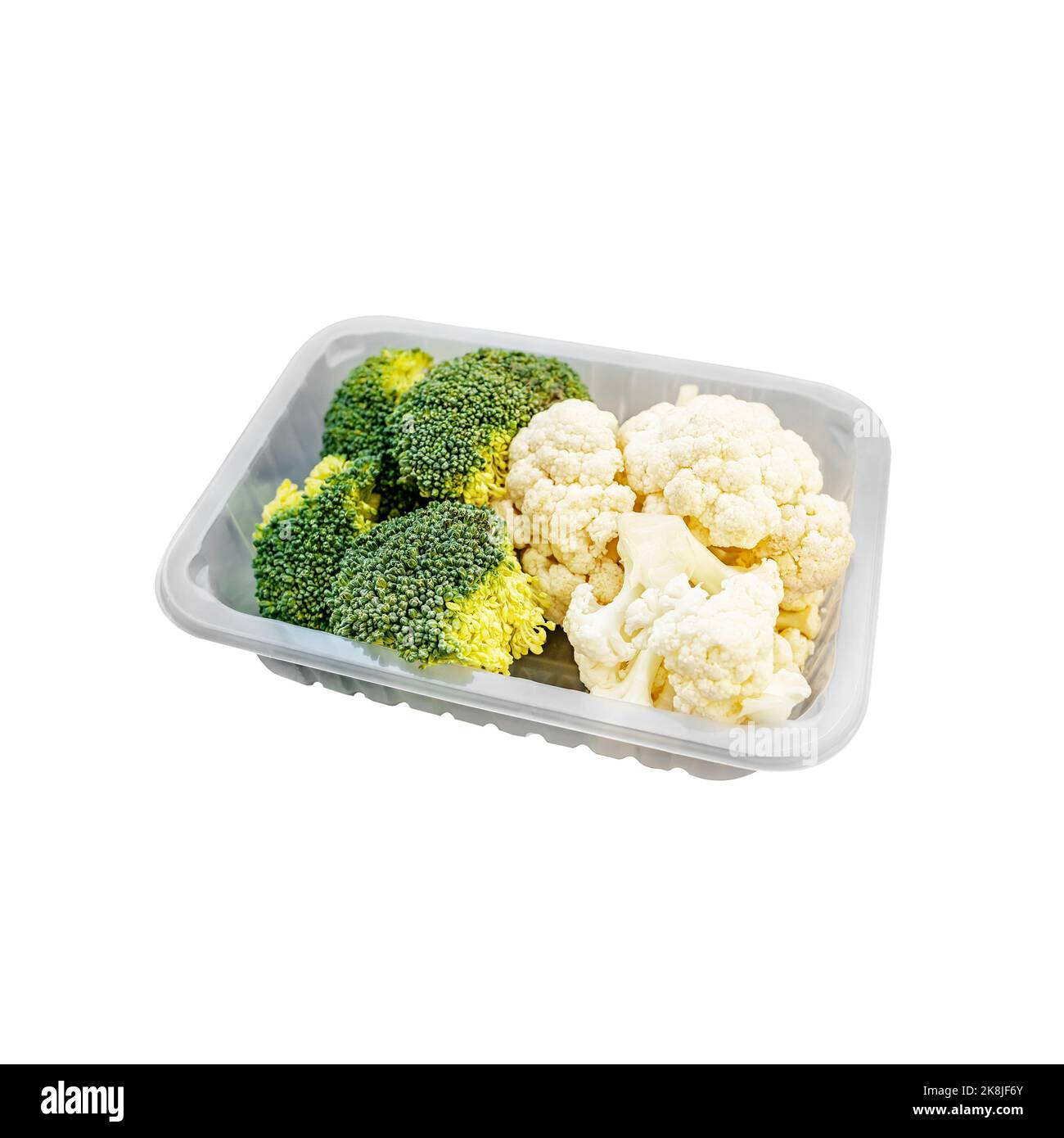 lot of broccoli and cauliflower on the table in a plastic box on an ...