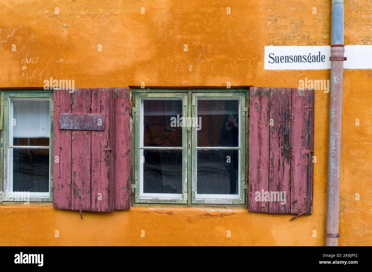 Distinctive yellow terraced houses in the Nyboder district of ...