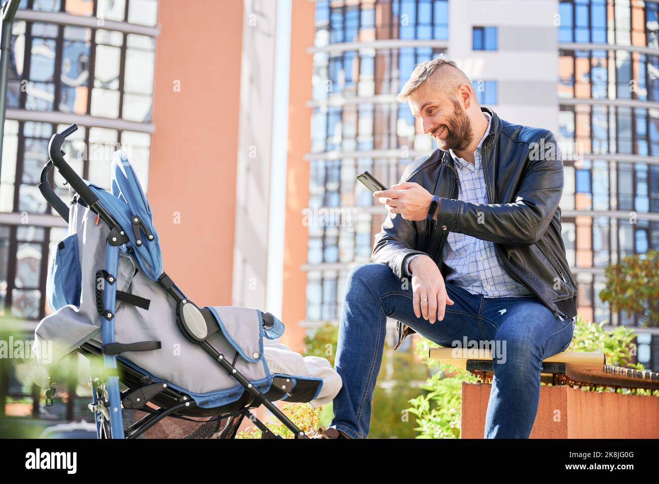 Loving father taking picture of newborn kid, while spending time ...
