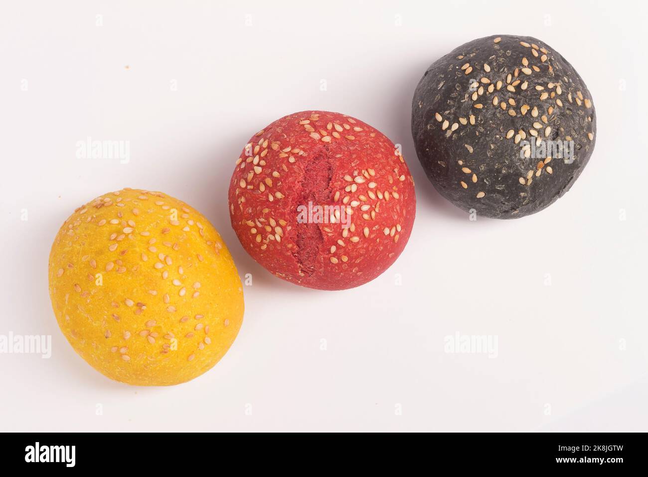 Colorful seasoned bread resting on a white background Stock Photo - Alamy
