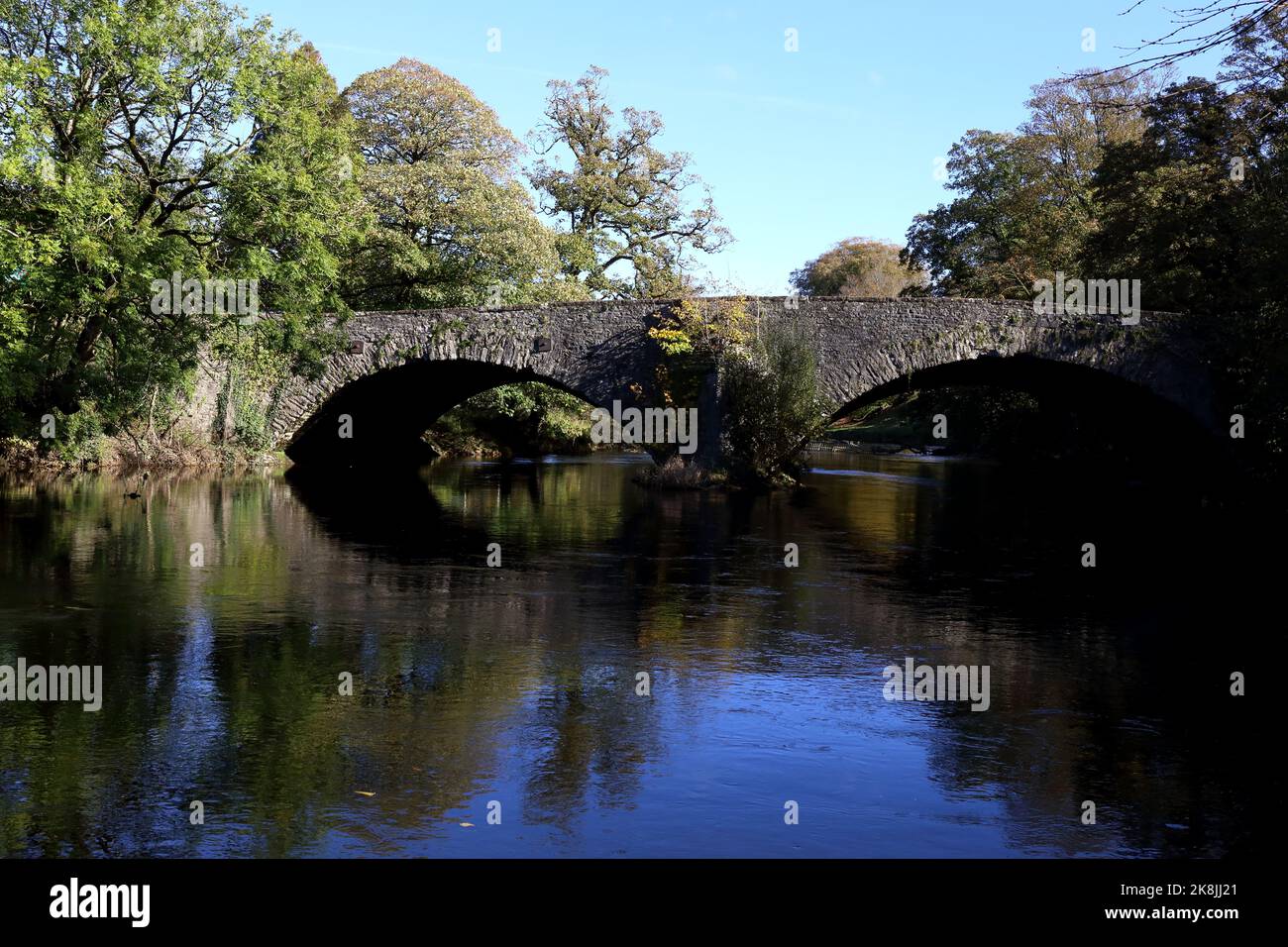 Old road bridge carrying the A6 main road across the River Kent at ...